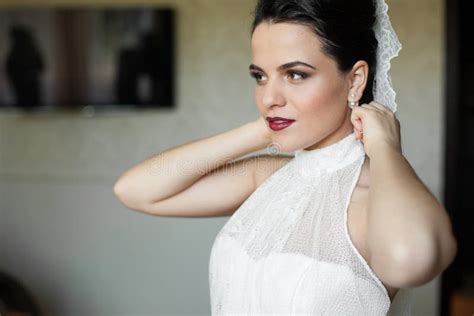 Beautiful Brunette Bride Smiling And Posing In Hotel Room Closeup Stock