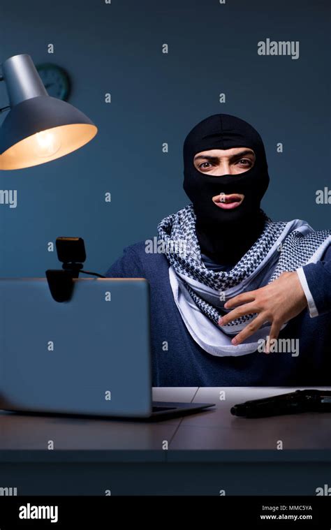 Hacker Wearing Balaclava Mask Hacking Computer Stock Photo Alamy