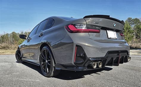 BMW G SERIES LCI M I FITTED STYLE DIFFUSER WITH CENTER REFLECTOR GLOSS BLACK Infinite