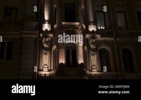 Building With Columns And Figures Of Nude Women Architectural Style Illumination Night Stock