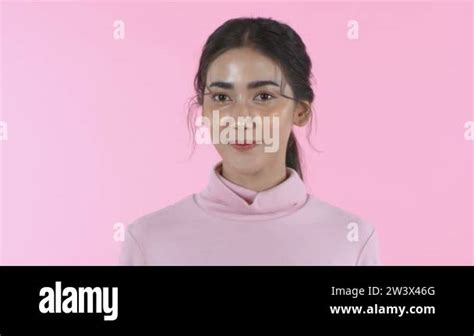 Beauty Concept Women Are Doing Gestures Do Not Use Loud Noises On A Pink Background 4k