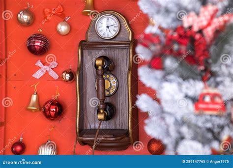Red Retro Phone Box With Vintage Wooden Telephone Is Decorated With