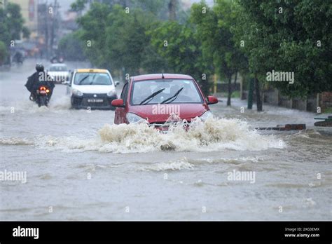 Monsoon Mayhem In Nepal Vehicles Wade Through A Flooded Road Section In
