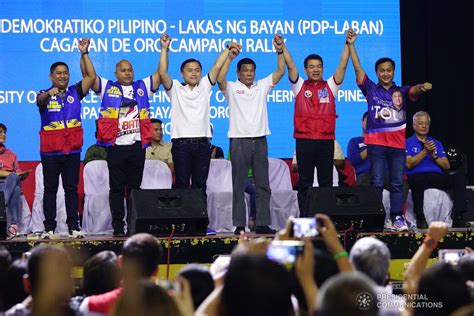 President Rodrigo Roa Duterte Raises The Hands Of Partido Demokratiko Pilipino Lakas Ng Bayan