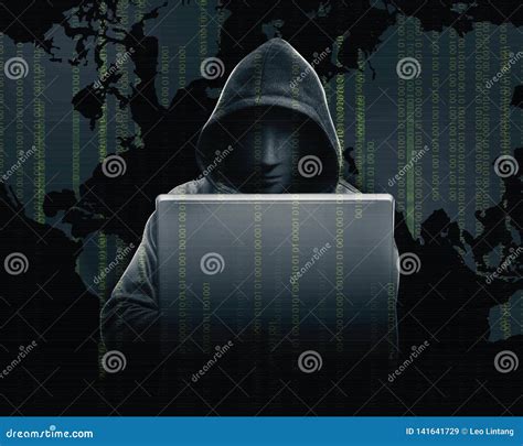 Hacker In Black Hoodie Holding Laptop With His Hand And World Map With Binary Code Stock Image