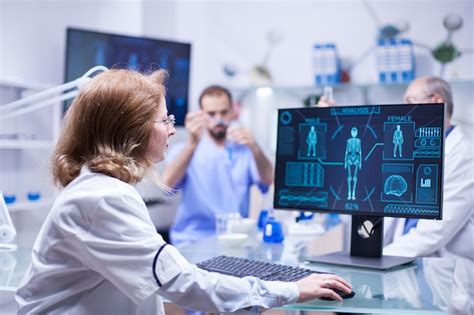 Premium Photo Middle Age Female Scientist Working A In Laboratory Typing A Report On Computer