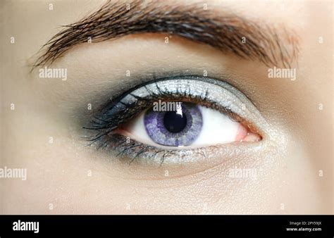 Violet Mutation Eyes Close Up The Human Eye Of A Woman With Light