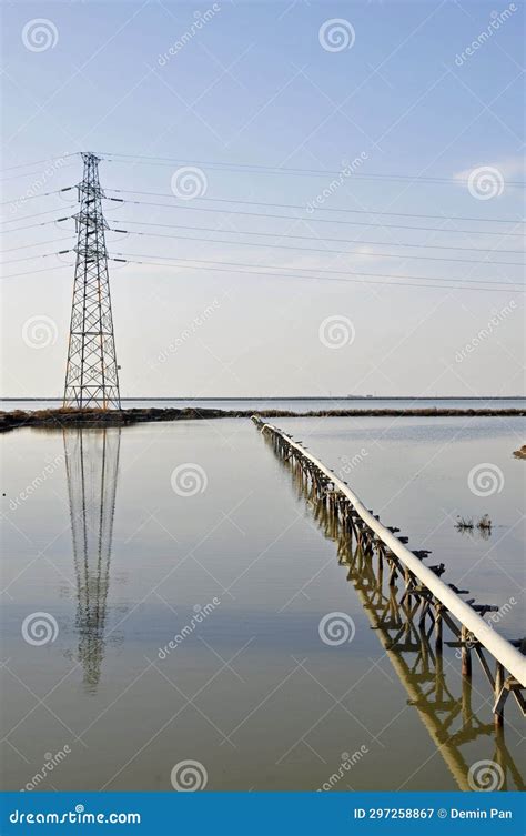 Pylon And Simple Reflection In The Water Pipe Equipment Stock Image Image Of Steel Orange