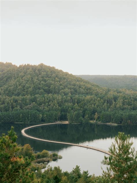 BuroLandschap Snakes Cycling Between Terrils Bridge Over Belgian Lake