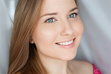 Beautiful Woman With Liquid Make Up Foundation On Her Skin Stock Image