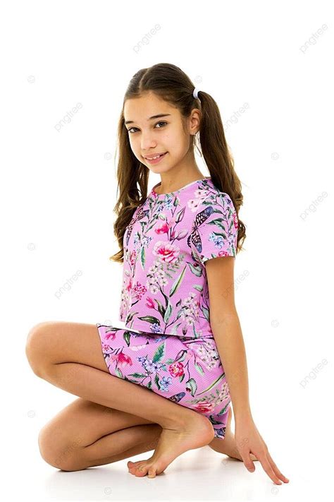 On A White Background A Small Girl Is Kneeling Photo And Picture For