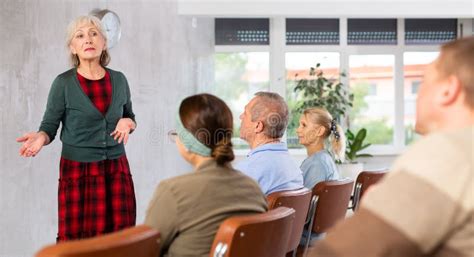 Female Tutor Leading Educational Class For Group Of Elderly People Stock Image Image Of