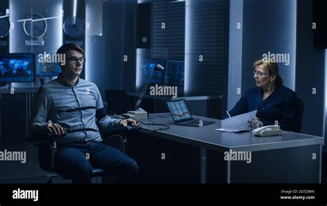Female Special Agent Conducts Lie Detector Polygraph Test On A Young