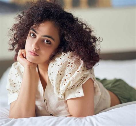 In Pics Nithya Menen Poses On Bed