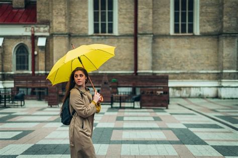 Premium Photo Woman Holding A Yellow Umbrella