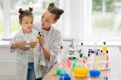 Premium Photo Woman With Girl In Lab