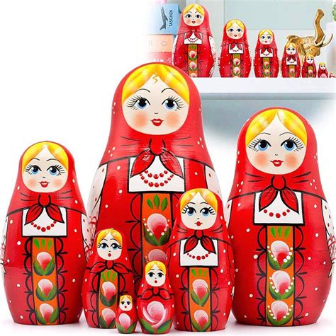 A Group Of Red Nesting Dolls Sitting Next To Each Other