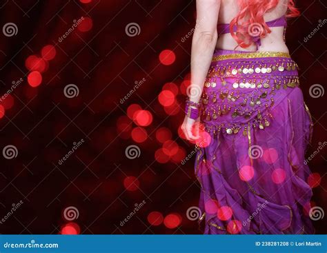 Belly Dancer Wearing Purple Dance Costume Close Up With Bokeh Stock