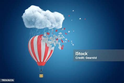 파란색 카피 스페이스 배경에 비가 내리는 구름 아래에서 조각으로 부서지기 시작한 줄무늬 열기구의 3d 렌더링 3차원 형태에 대한