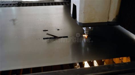 Industrial Laser Cutting Metal Sheet Creating Precise Shapes Stock