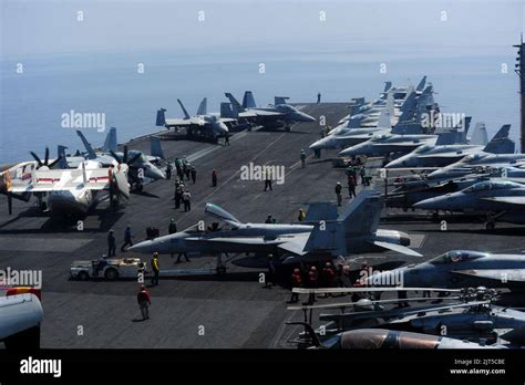 U S Sailors Move Aircraft Aboard The Aircraft Carrier Uss George H W Bush Cvn 77 Sept 140902