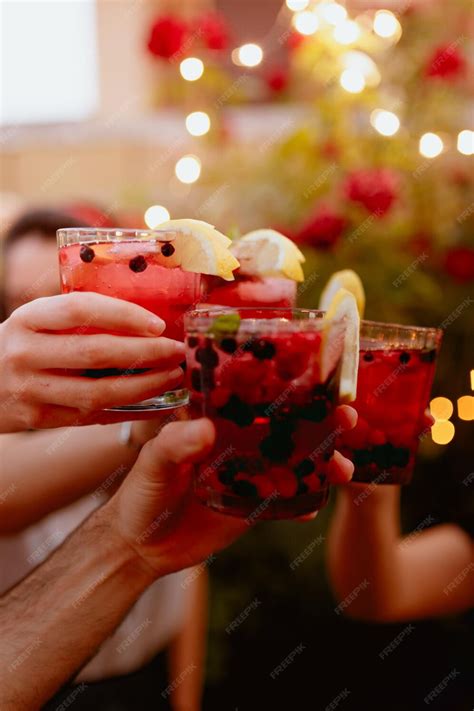 Premium Photo Group Of Friends Clinking Glasses At Party