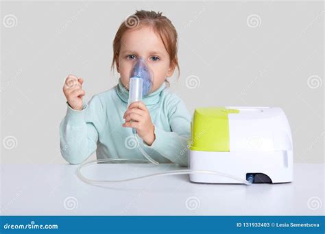Beautiful Sick Girl Has Inhalation Therapy Uses Portable Nebulizer