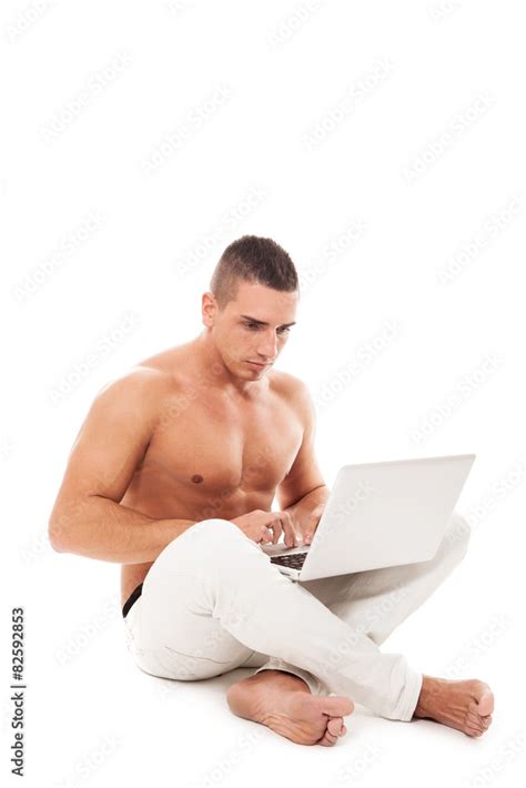 Caucasian Man With Naked Chest Working With Notebook On The Floo Stock Photo Adobe Stock