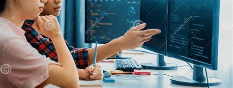 Female Programer Explain While Pointing Code Displayed On Computer