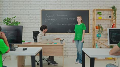 Student And Instructor Discuss Python Code In Modern Classroom Stock Footage Video Of Training