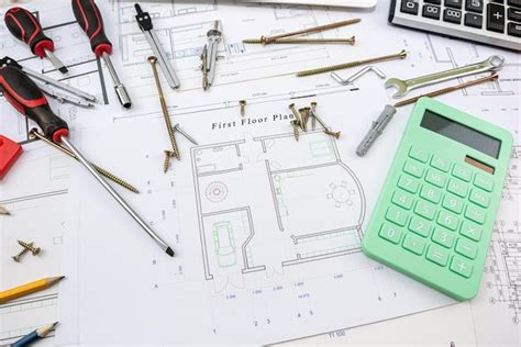 Premium Photo Drawing And Drafting Table With Drawing Tools Spread Out Tools And Drawings