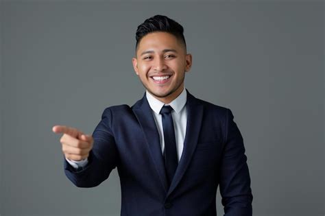 Premium Photo A Man In A Suit Pointing At The Camera