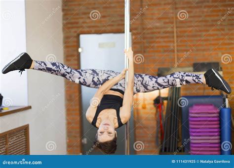 Girl On A Pole In The Gym Doing Exercise Stock Image Image Of Contact