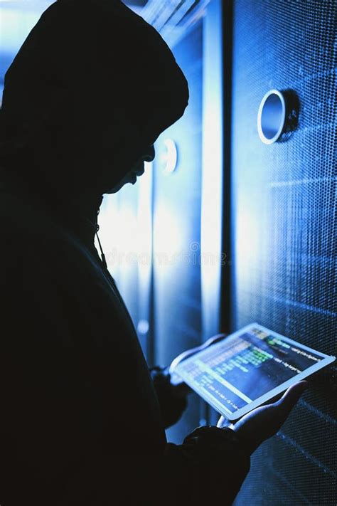 Stealing Is Always So Thrilling A Hacker Using A Digital Tablet In A Server Room Stock Image