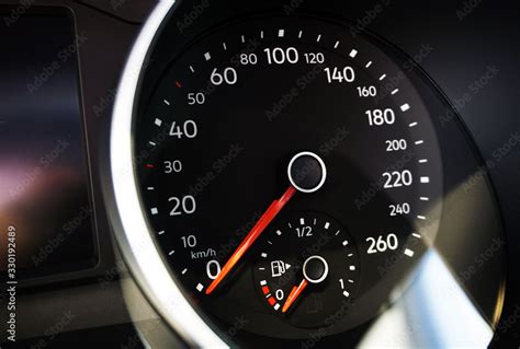 Speedometer Of A Modern Car With An Integrated Fuel Gauge In The Tank With Red Arrows The