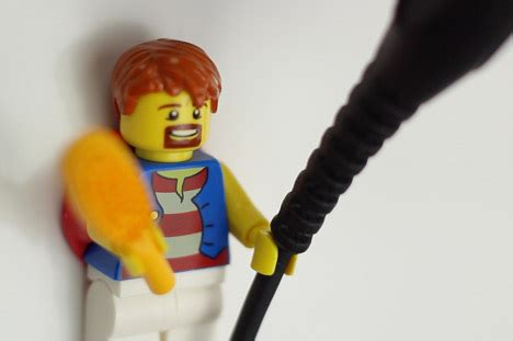 Lego Figurines Provide Makeshift Holders For Apple Firewire Cables