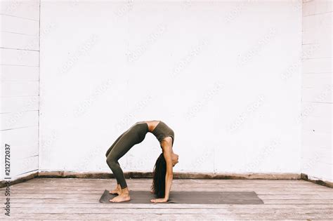 Attractive Model In Yoga Pose On White Background In Sexual Clothes Stock Photo Adobe Stock