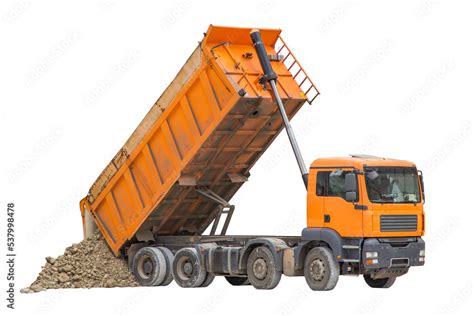 Unloading Soil From A Dump Truck The Work Of Construction Equipment In The Production Of