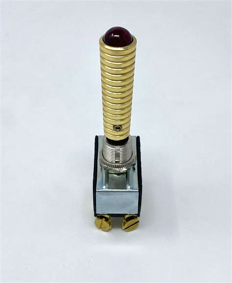 Ribbed Gold Toggle Switch Extension With Gemstone Diamond Logo