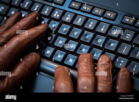 Hacker Using Laptop Lots Of Digits On The Computer Screen Stock Photo