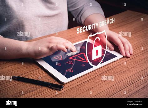 Woman Using Digital Tablet With System Breach Warning On Screen Cyber