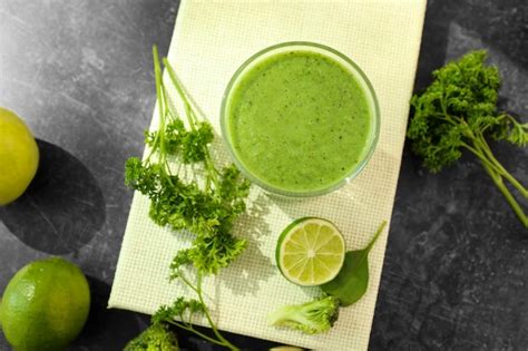 Premium Photo Fresh Green Smoothie And Ingredients On Table