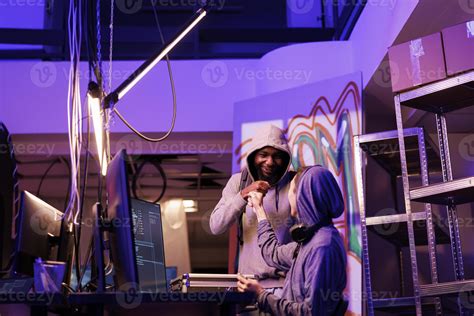 Cheerful Hackers Bumping Fists While Hacking Online Server Successfully Internet Criminals