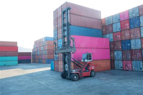 Container Loading And Unloading Equipment In The Harbor Import And Export Concept Stock Photo