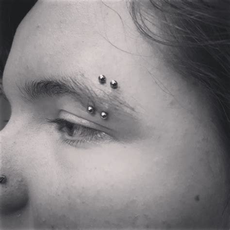 Double Eyebrow Piercings