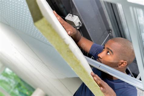 Man Fitting Ceiling Panel Stock Image Image Of Black 309077873