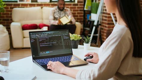 Asian Female Programmer Works On Coding Software In A Home Office Setup