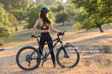 Girl On A Mountain Bike On Offroad Beautiful Portrait Of A Cyclist At