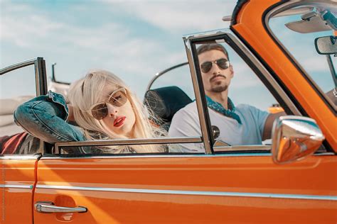 Beautiful Couple In A Retro Car On Road Trip Travel By Stocksy
