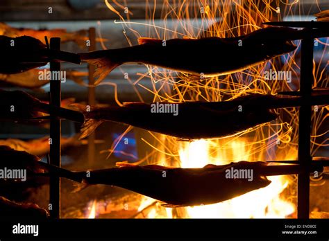 Saibling Fish Roasting On Open Fire In Fischerhütte Near Lake Altaussee